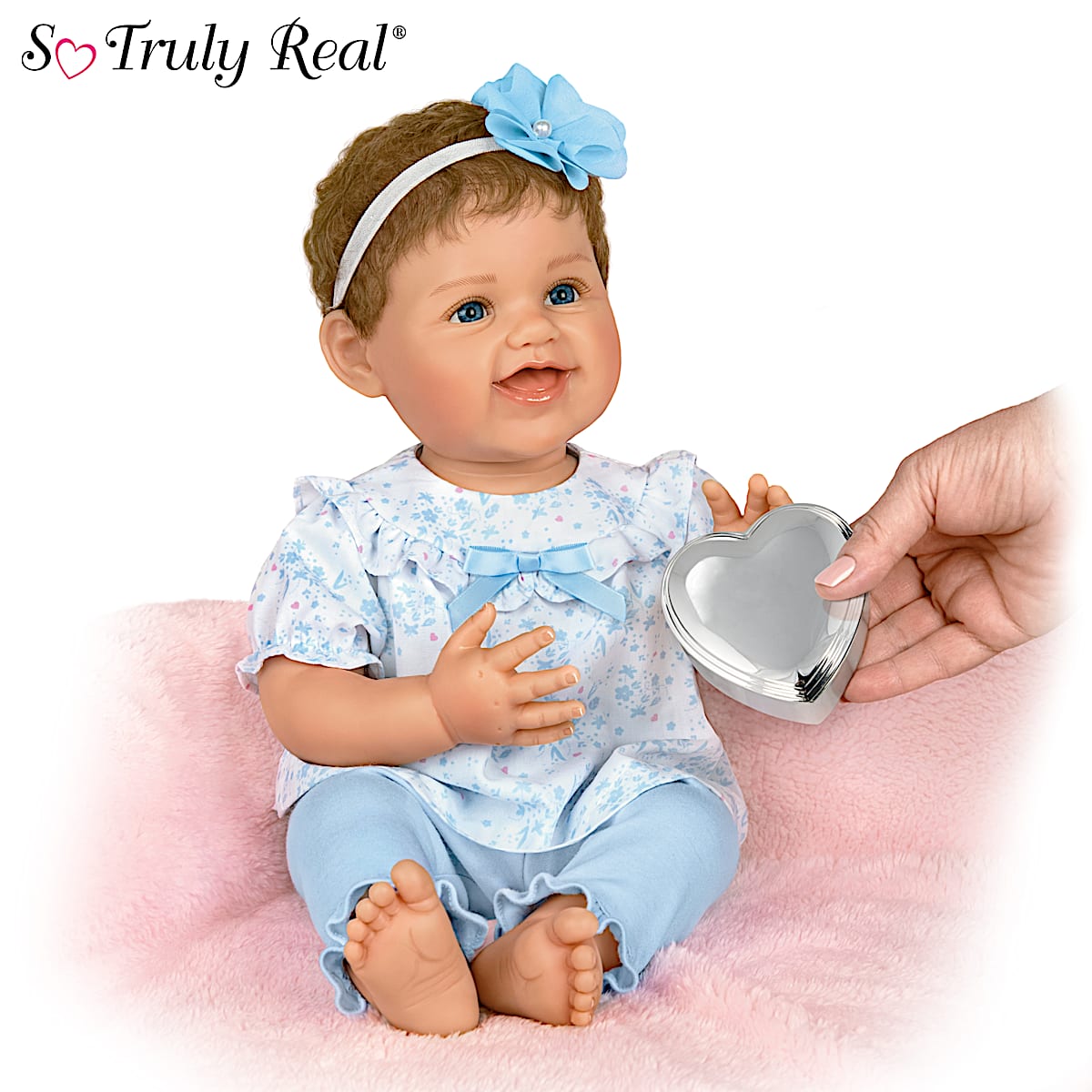 Poseable Lifelike Baby Doll With A Blue Floral Outfit And Heart-Shaped ...